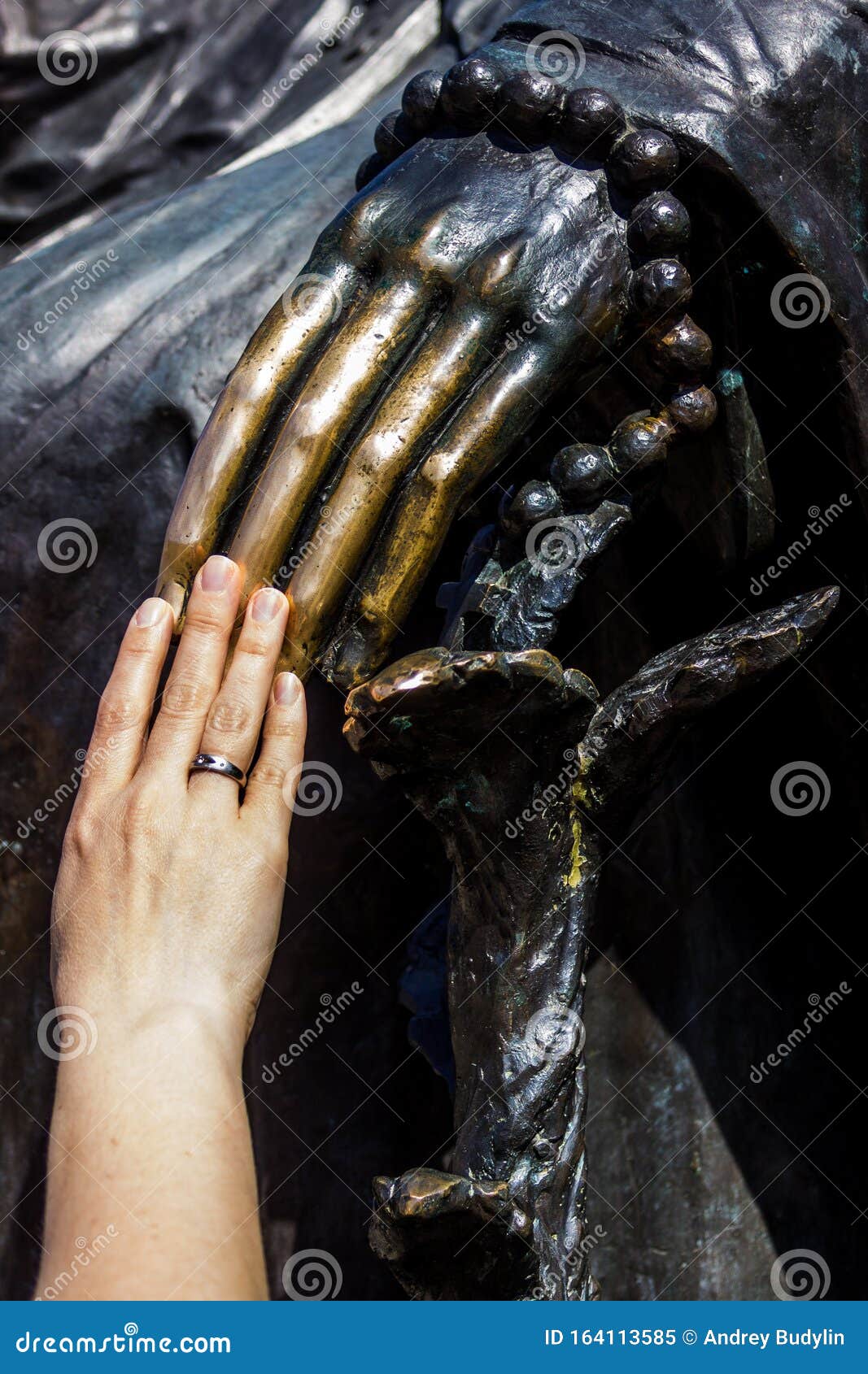 Touching a Saint stock image. Image of woman, spring - 164113585