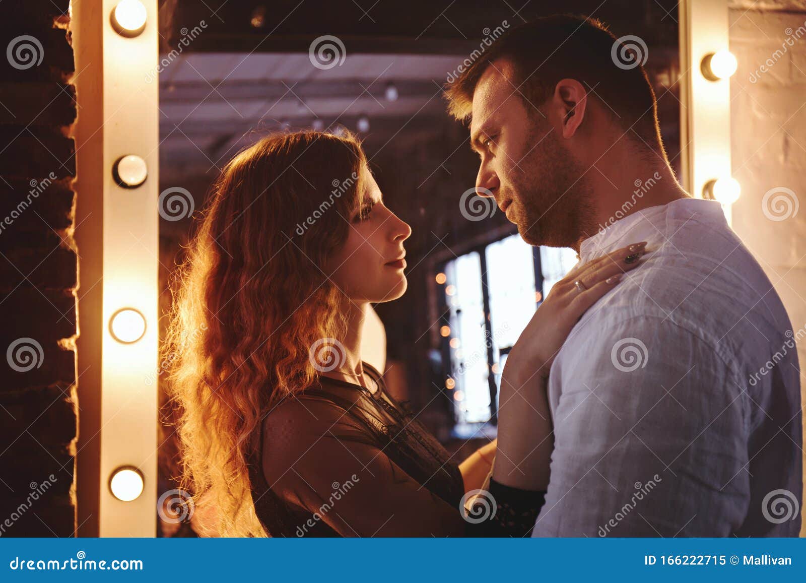Touching Young Couple in Hug Stock Image - Image of cozy, couple: 166222715