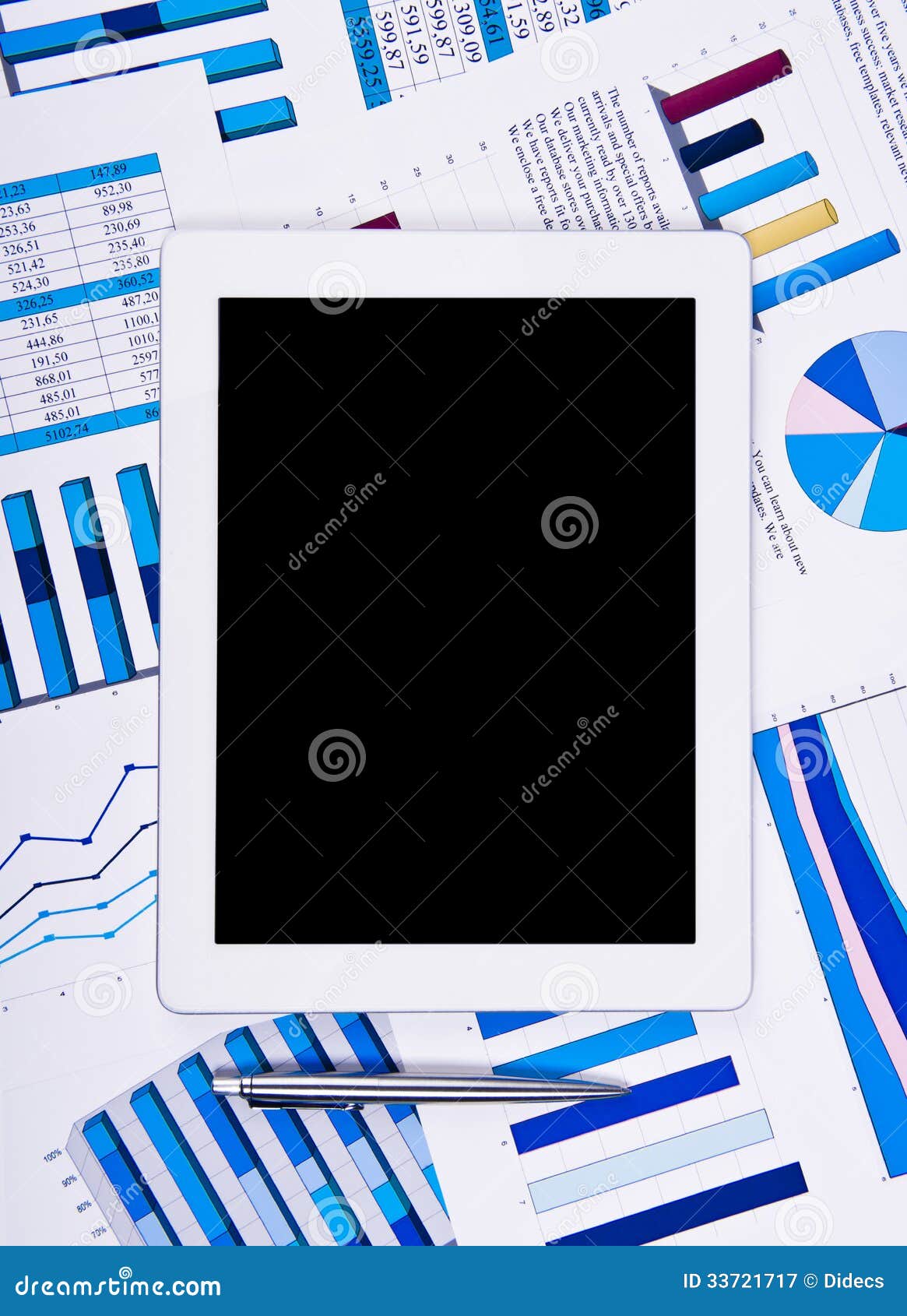 Touchpad Above Financial Paper Charts and Graphs Stock Image - Image of ...