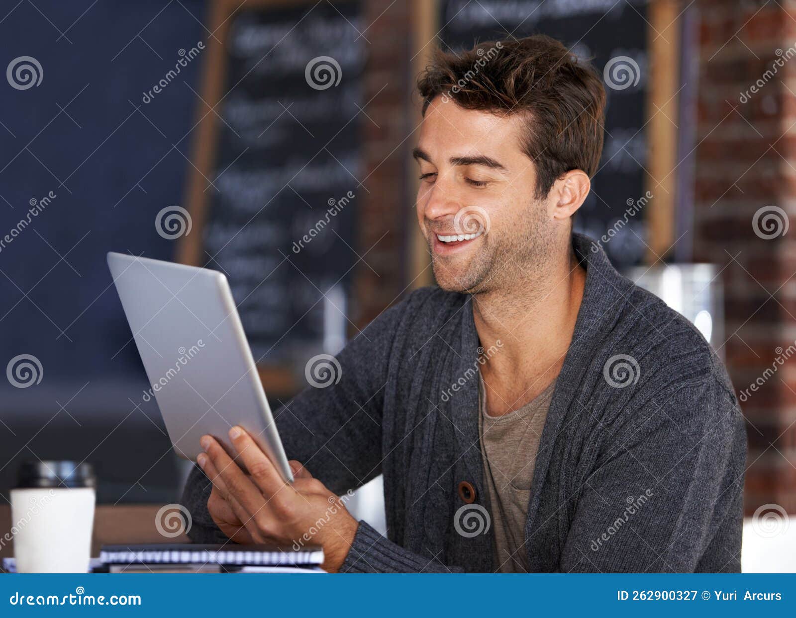Touchscreen Technology. a Young Man Working on a Digital Tablet in a ...