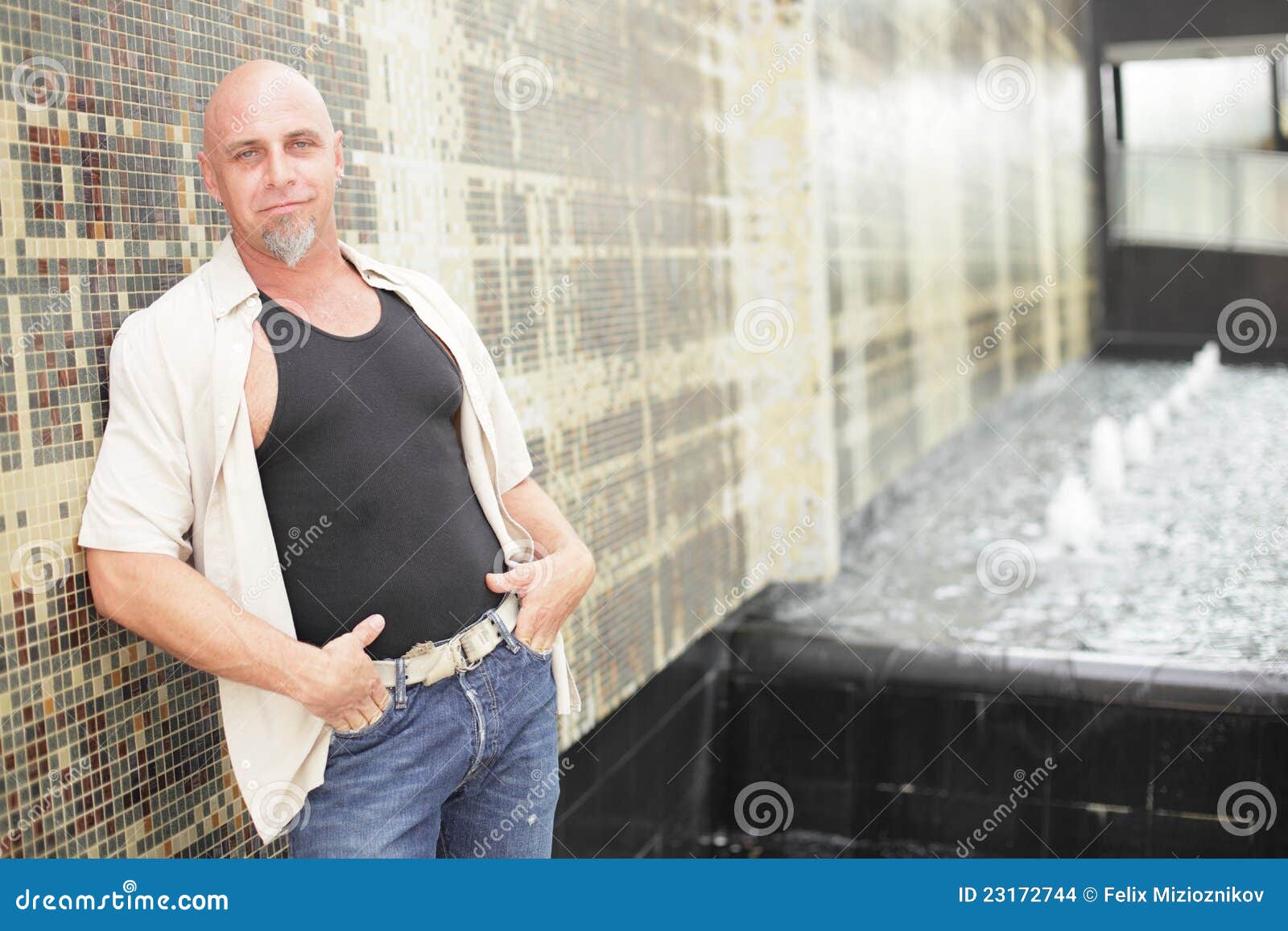 Tough Guy Leaning on a Wall Stock Photo - Image of wall, tough: 23172744
