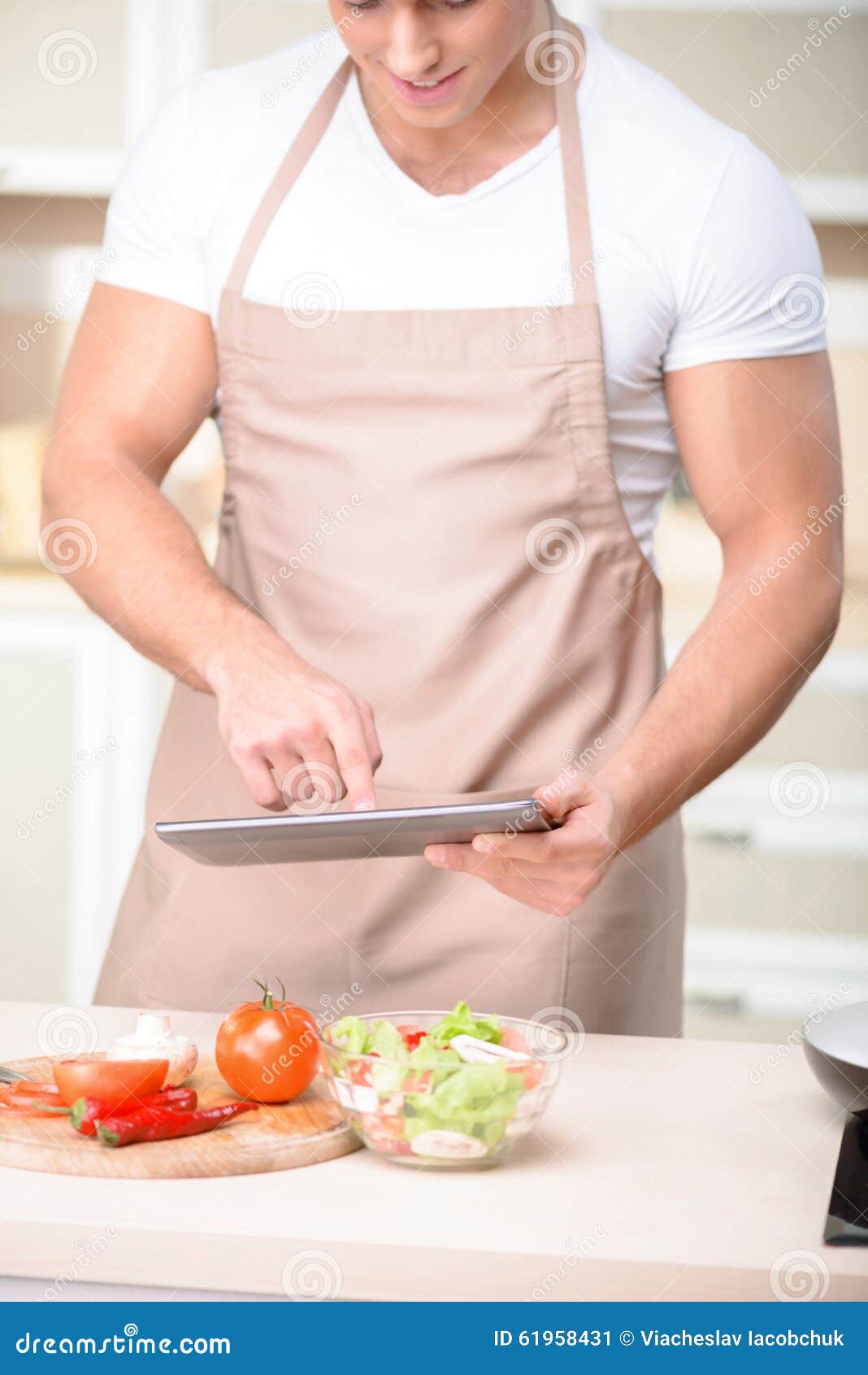 Tough-looking Guy in the Kitchen Using His Tablet Stock Image - Image ...