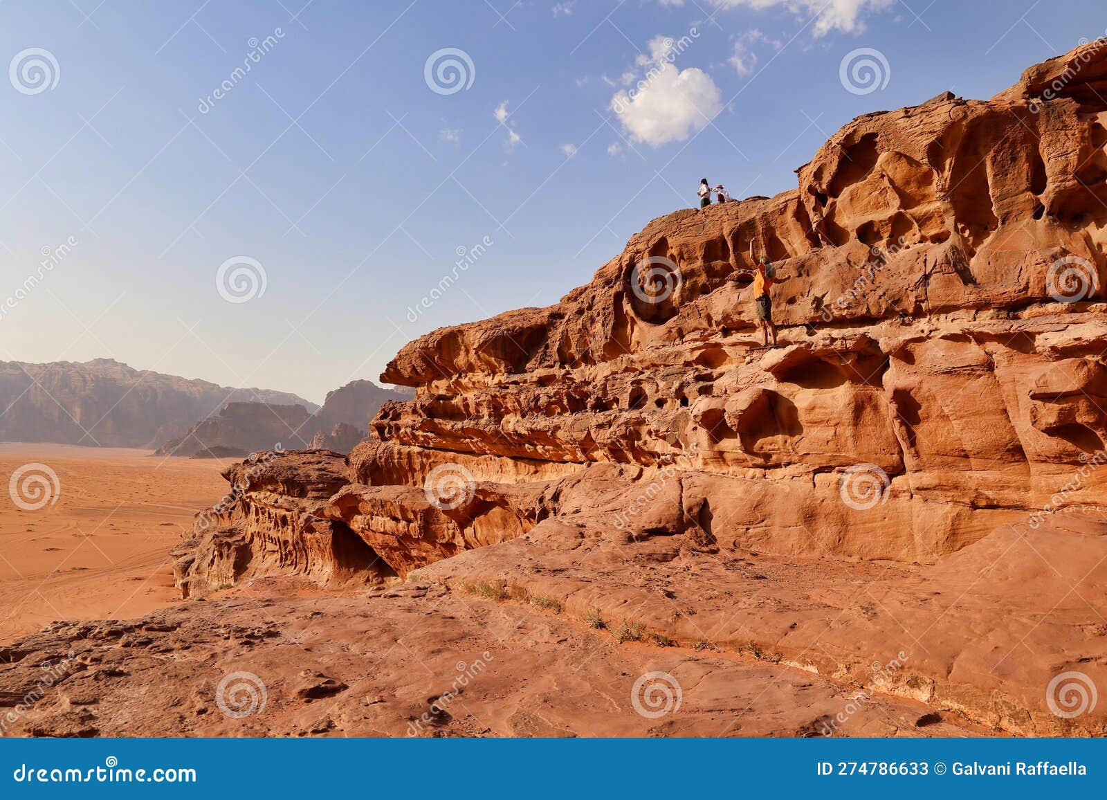 Touists on Rock Formations Visiting Wadi Rum Desert Stock Image - Image ...