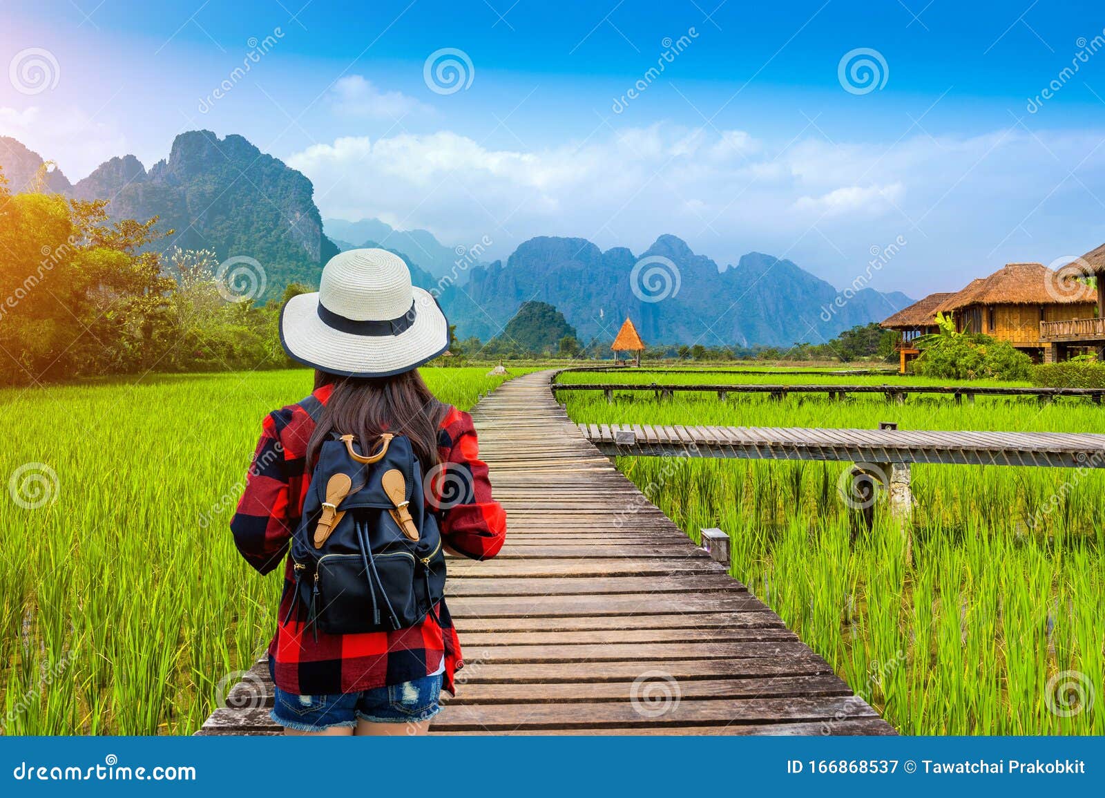 Tourism with Backpack Walking on Wooden Path, Vang Vieng in Laos. Stock ...