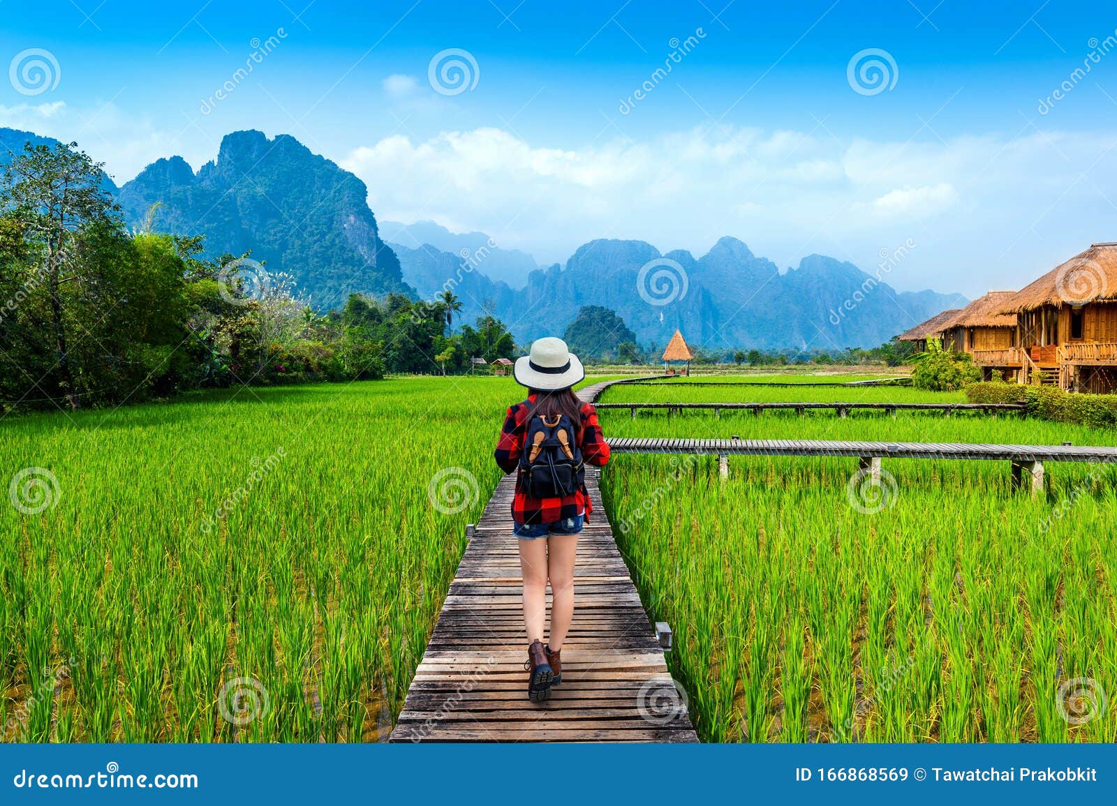 Tourism with Backpack Walking on Wooden Path, Vang Vieng in Laos. Stock ...