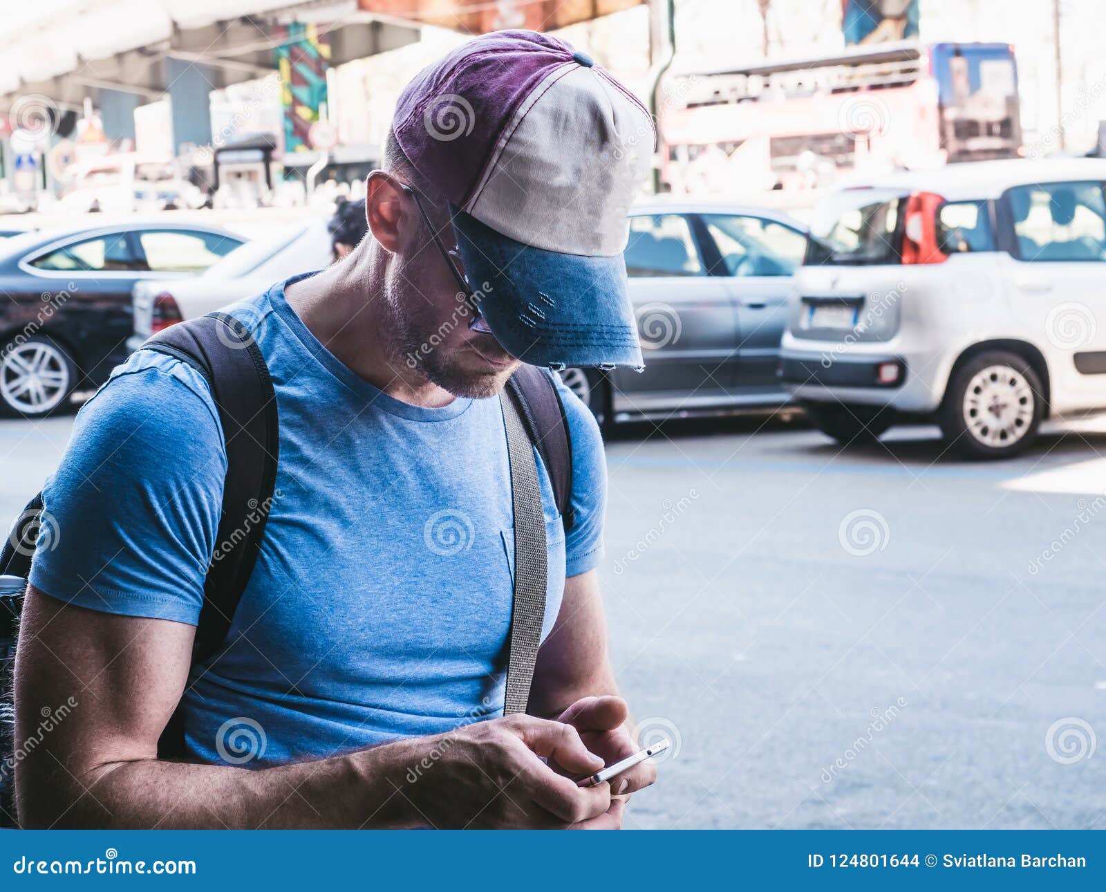 Tourist in a Baseball Cap and with a Backpack Stock Photo - Image of ...