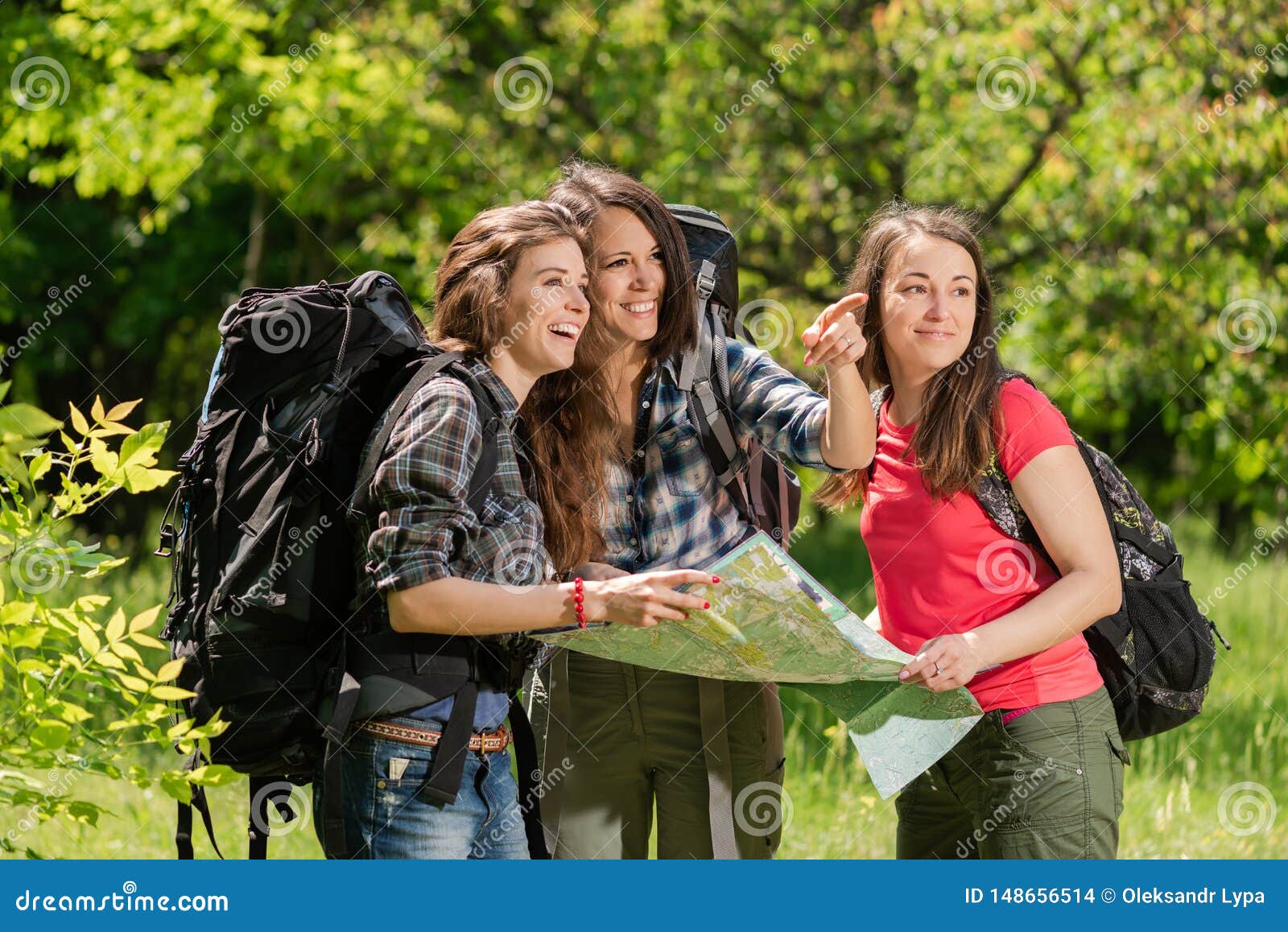 Tourist Girls at Forest with Map and Backpacks Stock Photo - Image of ...