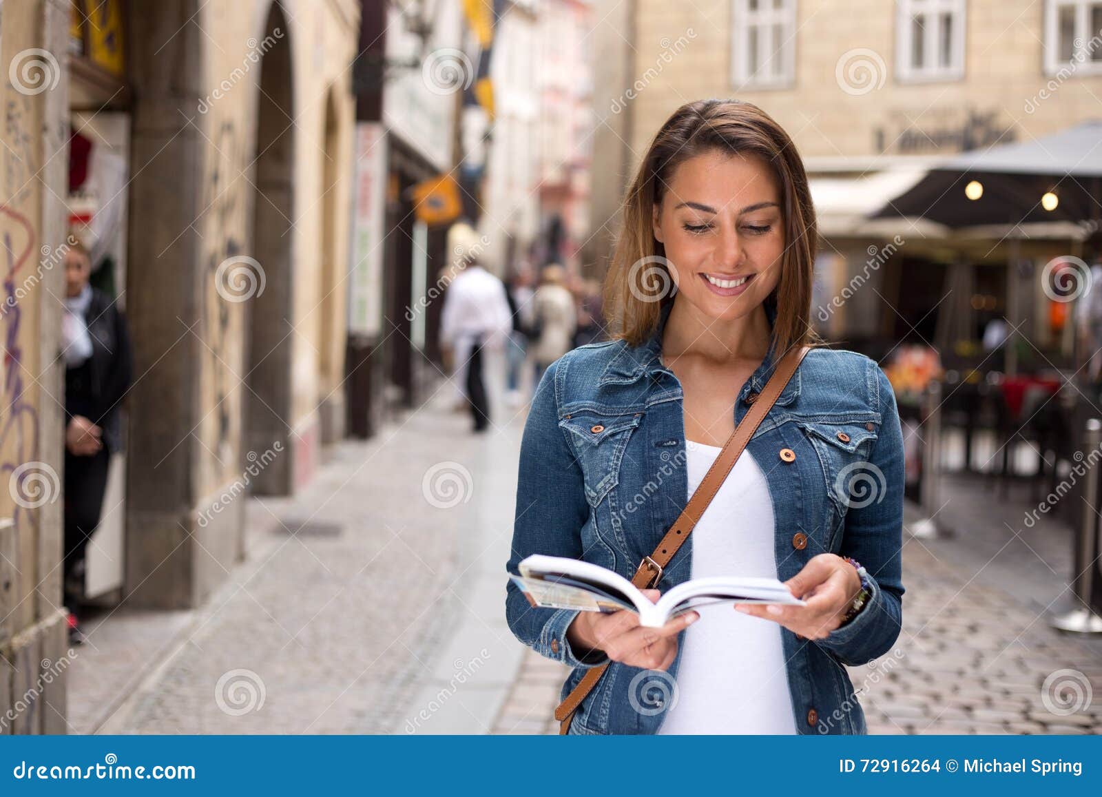 Tourist with guide book stock photo. Image of person - 72916264