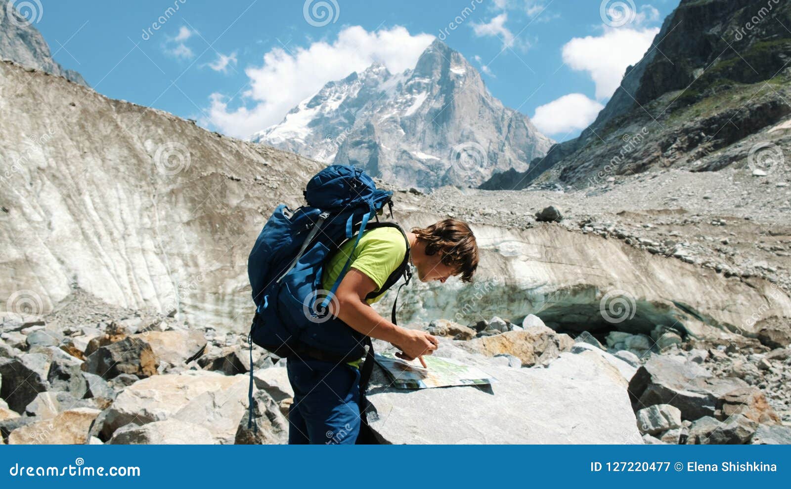 Tourist Guide a Man with a Backpack Studying the Route on the Map and ...