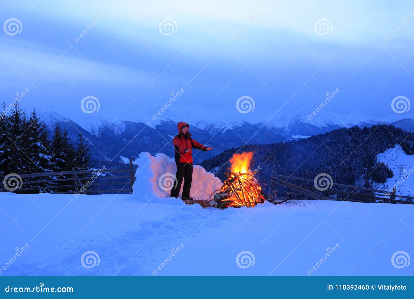The Tourist is Heating Near the Fire Stock Photo - Image of night, fire ...