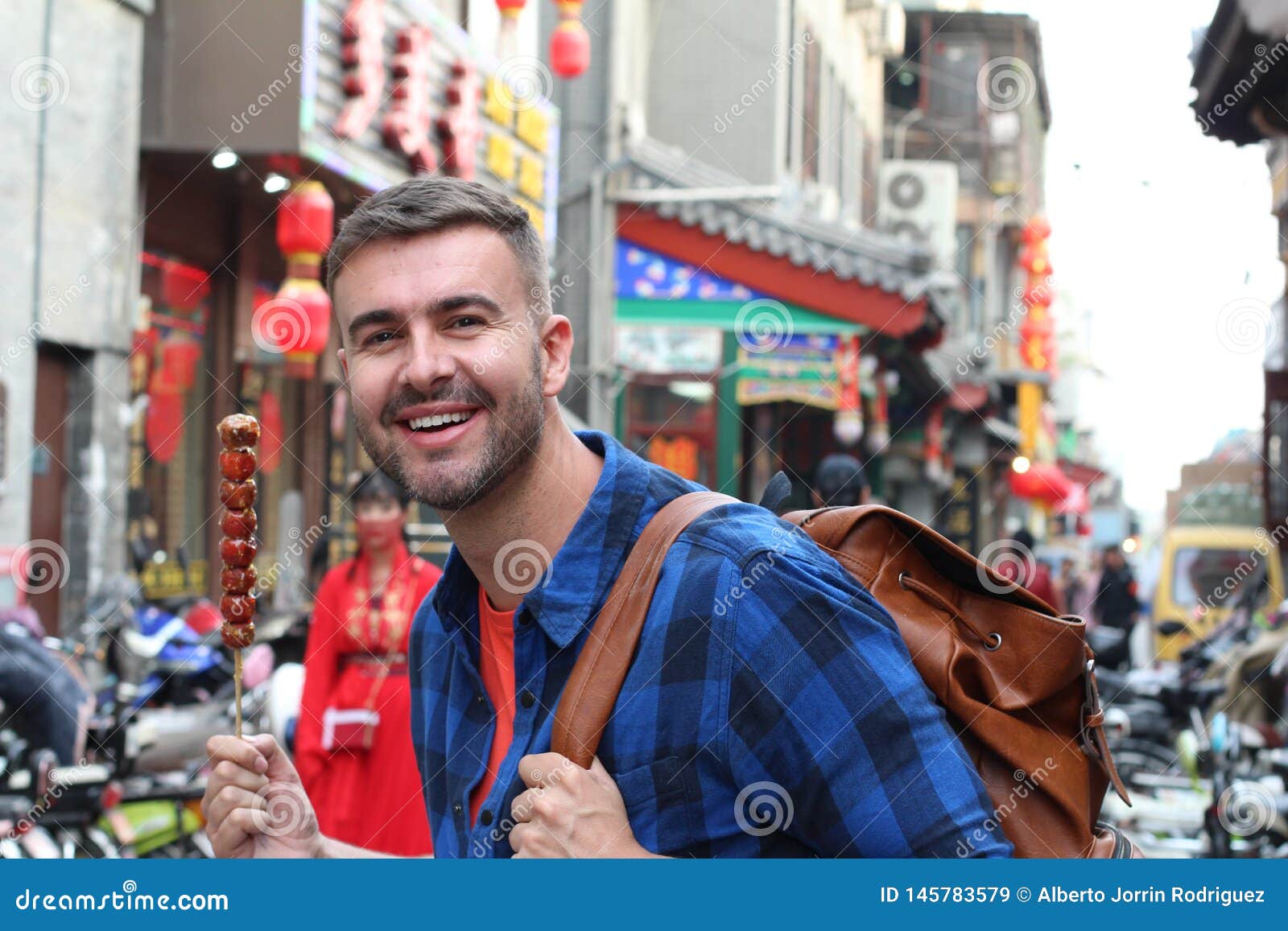 Tourist Holding Sugar-coated Haws on a Stick in China Stock Image ... Tourist Holding Sugar-coated Haws on a Stick in China Stock Image ...