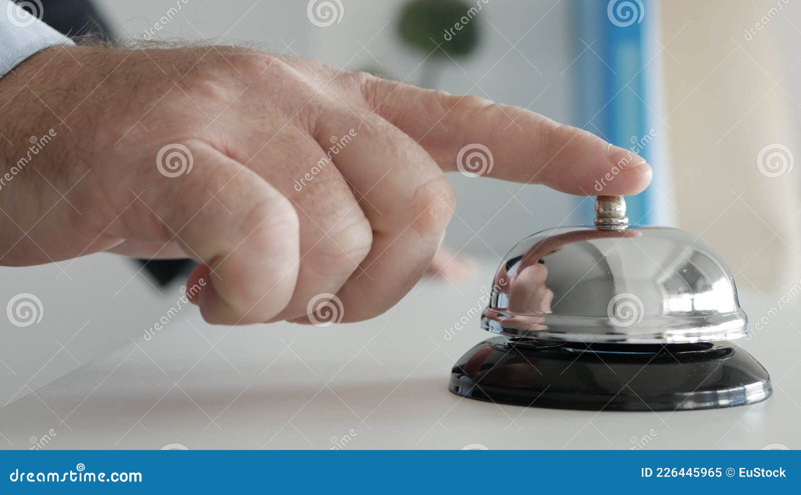 Tourist in Hotel Reception Presses the Bell Button Calling the ...