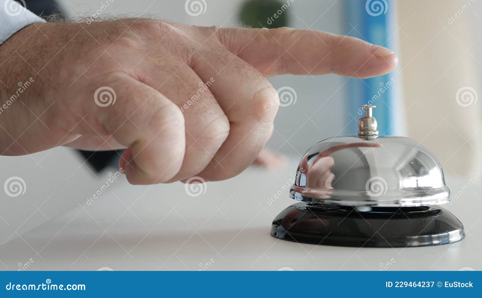Tourist in Hotel Reception Presses the Bell Button Calling the ...