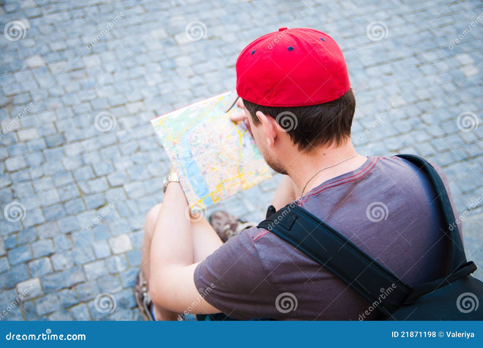 Tourist looking at a map stock photo. Image of handsome - 21871198