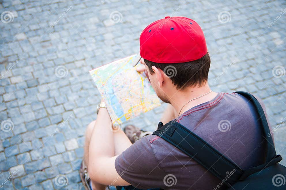 Tourist looking at a map stock photo. Image of handsome - 21871198
