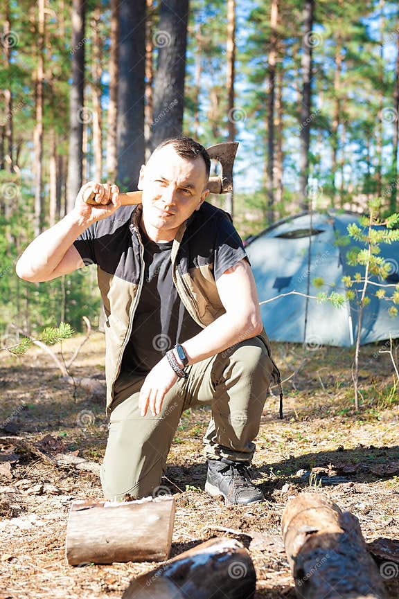 Tourist Man Chops Tree in Forest with Sharp Ax Stock Image - Image of ...