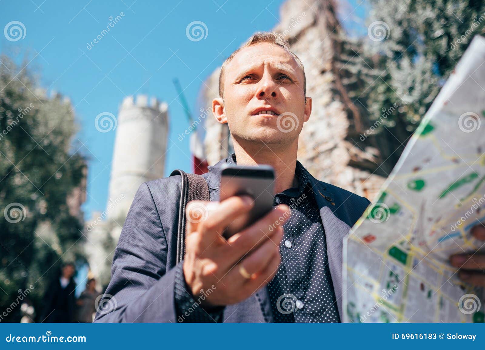 Tourist Man Try Navigate Himself with Map and Smartphone in Unknown ...