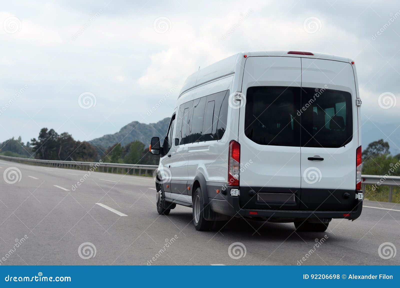 Tourist Minibus in Motion on Background Mountains Stock Photo - Image ...