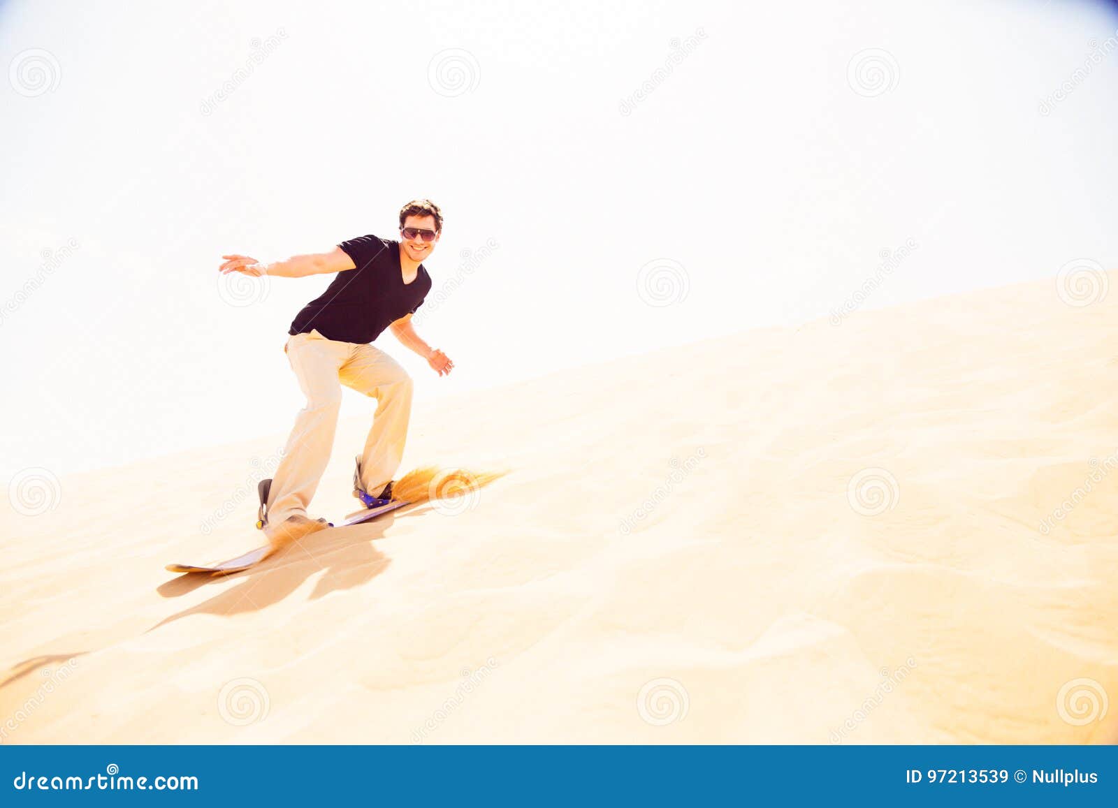 Tourist Sandboarding in the Desert Stock Image - Image of sand, nature ...