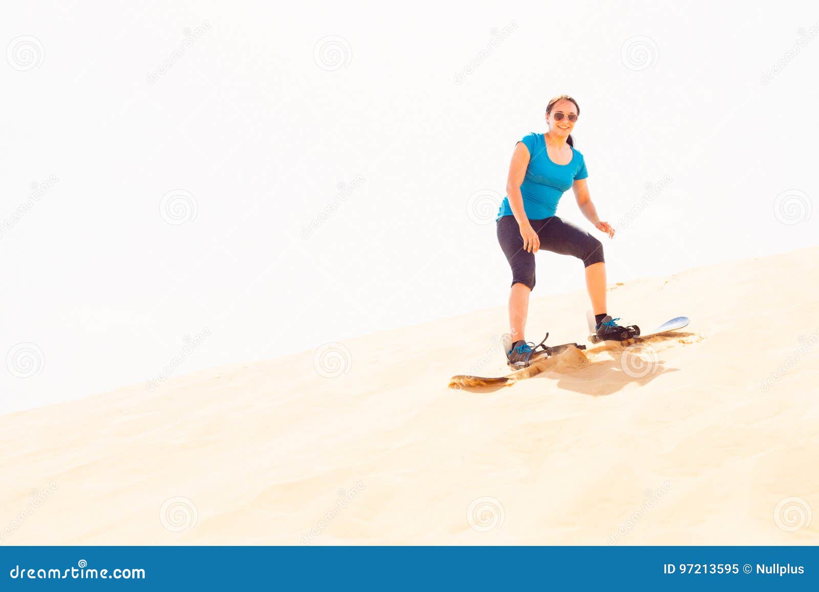 Tourist Sandboarding in the Desert Stock Image - Image of dubai, sand ...