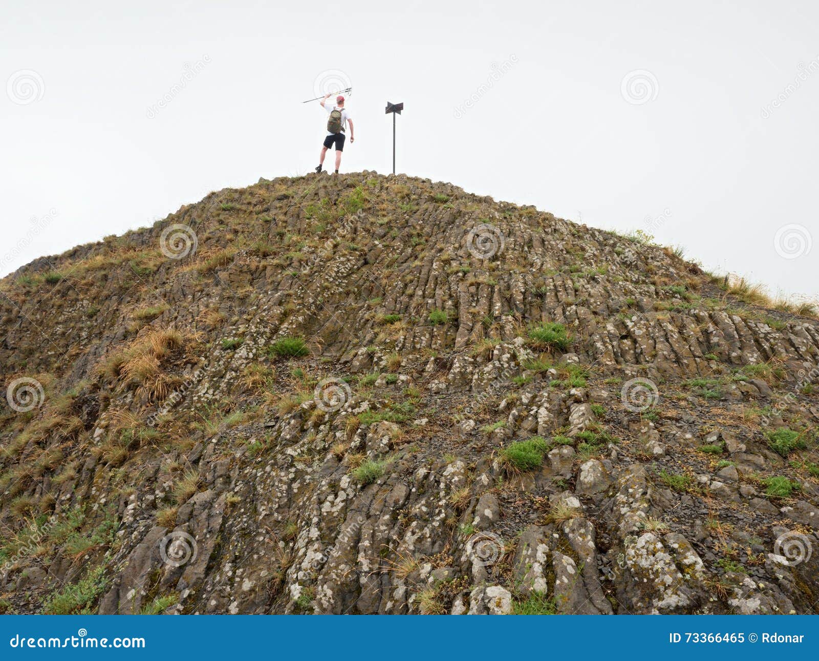 Tourist On Sharp Basalt Peak Of Volcano Formation Stock Image ...