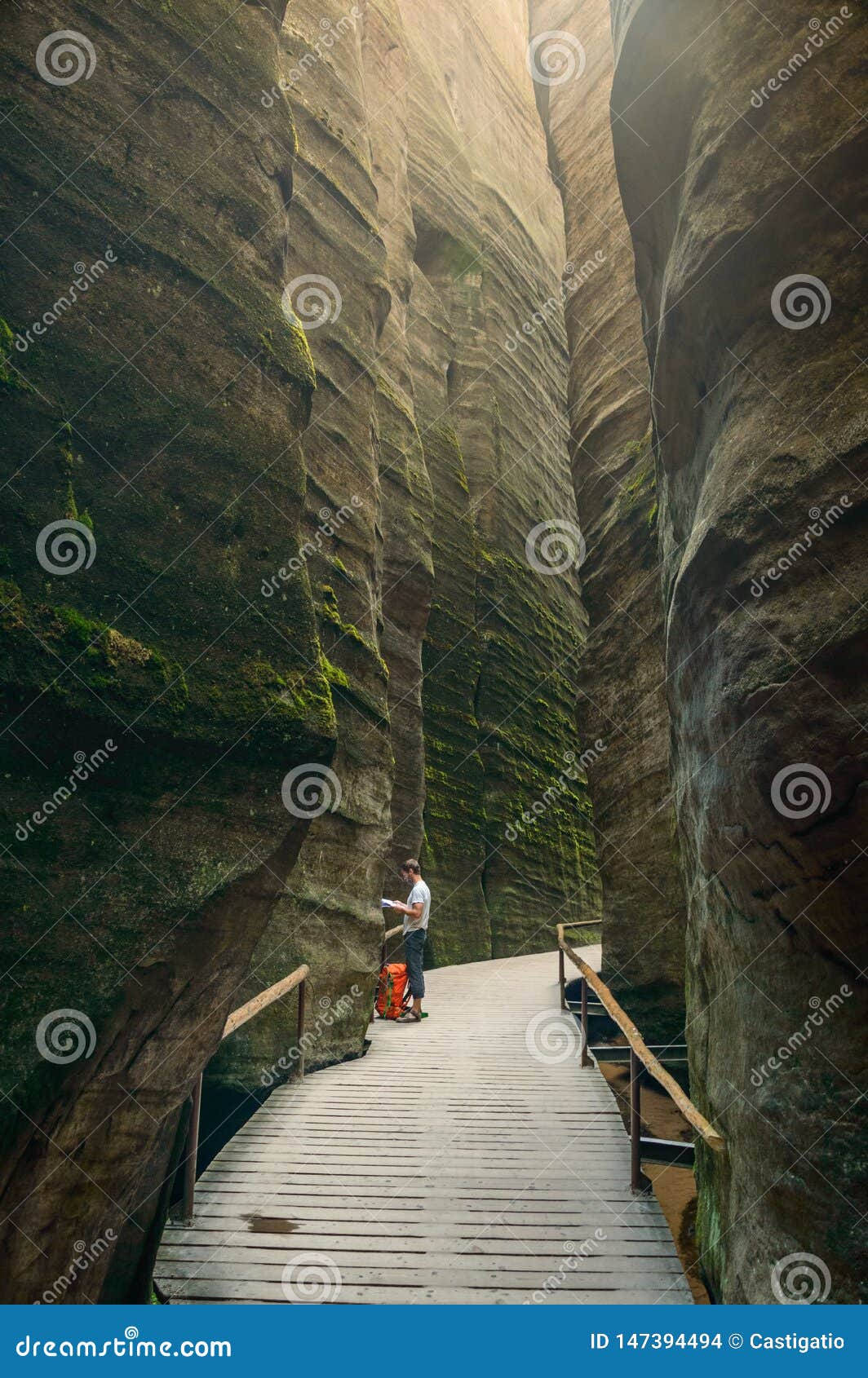 A Tourist on a Walking Trail between High Sandstone Rocks Editorial ...
