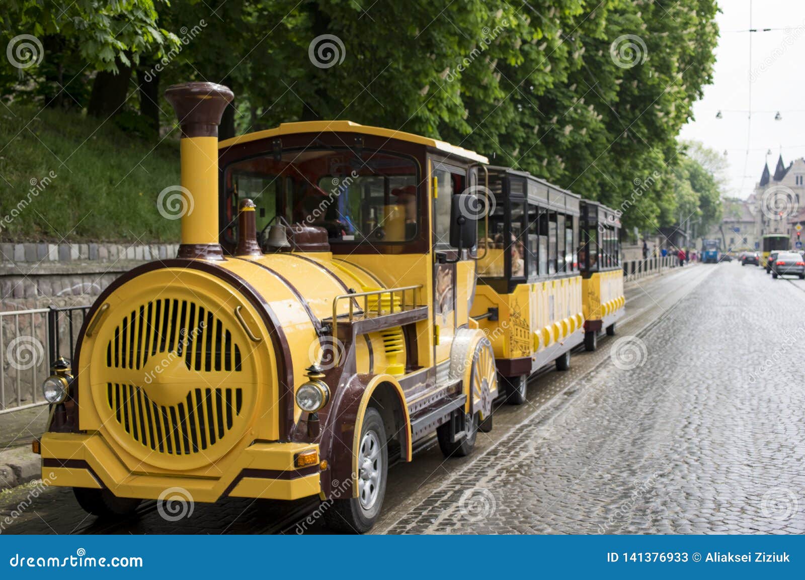 Tourist yellow train. stock image. Image of city, yellow - 141376933