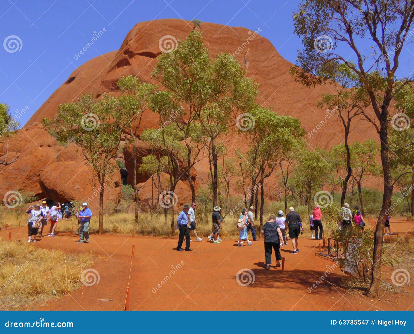 Tourists at Ayers Rock editorial photography. Image of rock - 63785547