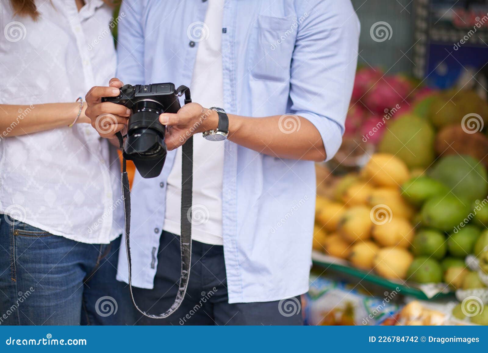 Tourists Checking Photos stock photo. Image of closeup - 226784742
