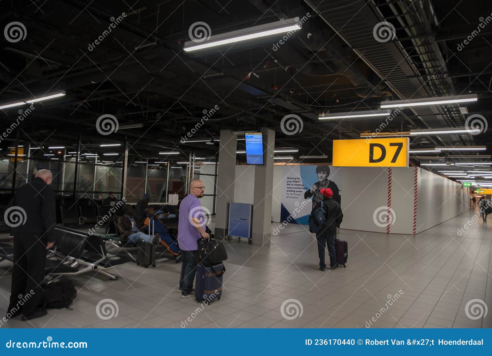 Tourists at the D7 Gate at Schiphol Airport the Netherlands 7-12-2019 ...