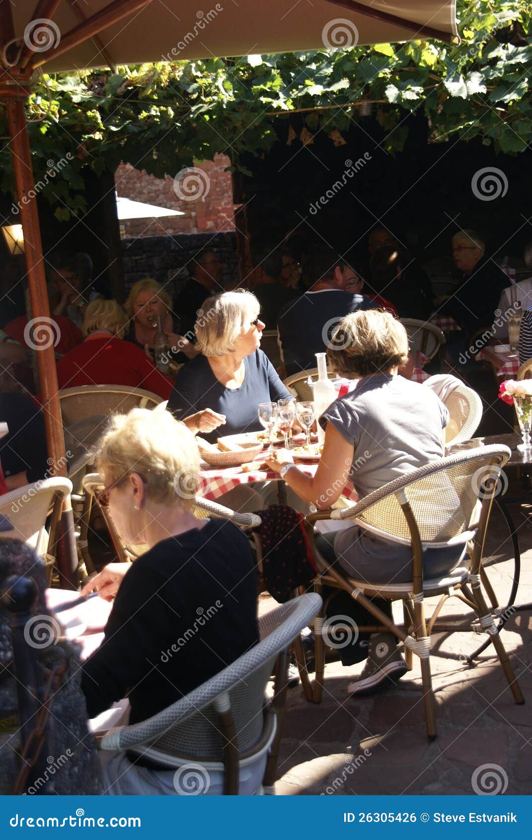 Tourists Enjoy a Relaxed Lunch in an Outdoor Restaurant Editorial Photo ... Tourists Enjoy a Relaxed Lunch in an Outdoor Restaurant Editorial Photo ...