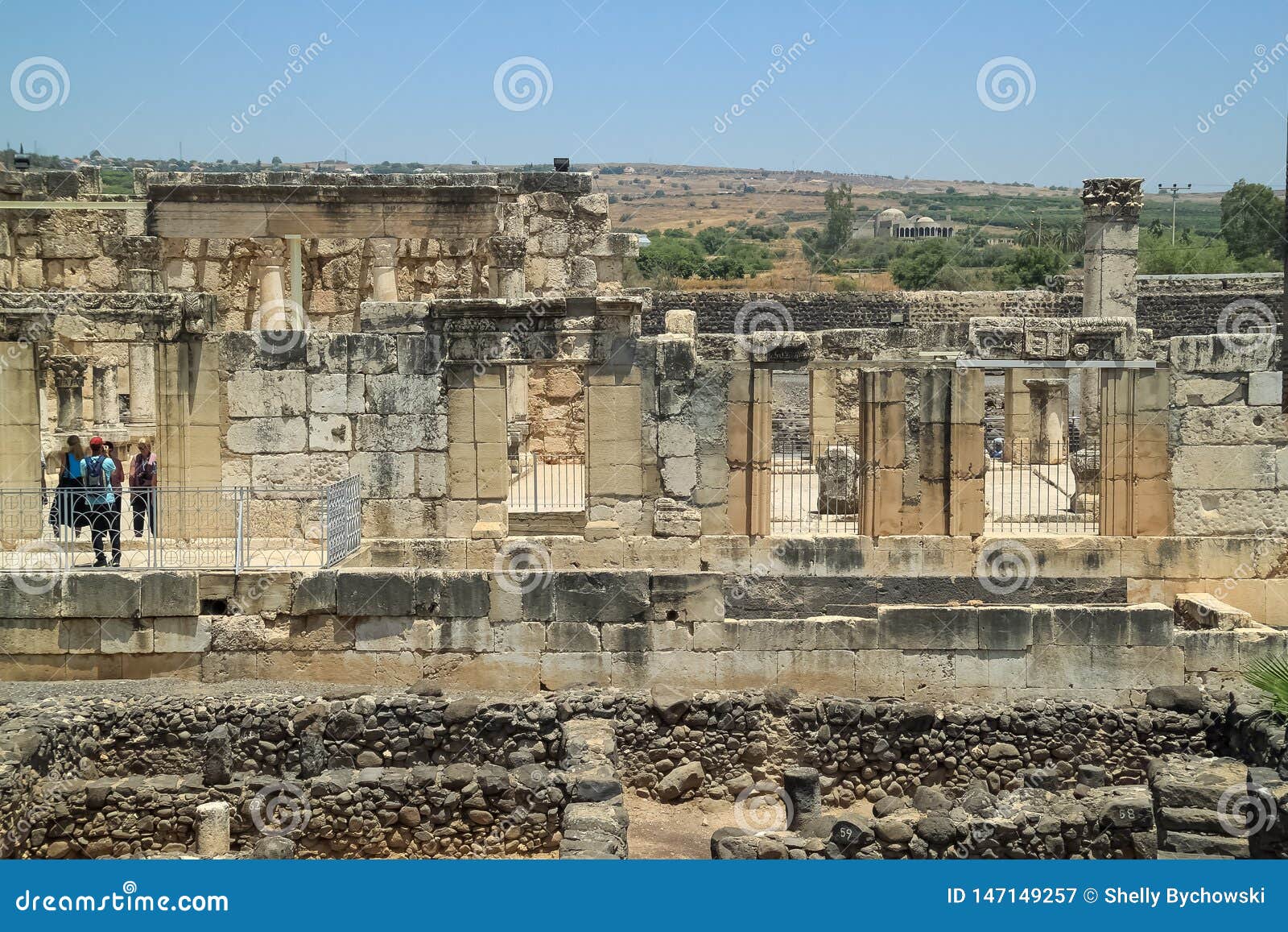 Tourists Explore the Ancient Ruins of a Synagogue at Capernaum ...