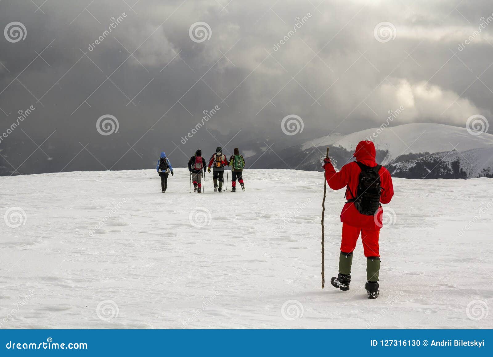 Tourists Hikers in Winter Snow Covered Mountains and Dramatic Cl Stock ...