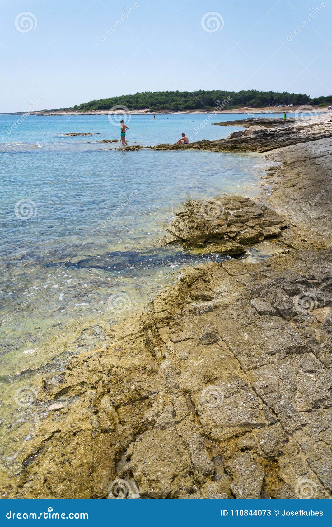 Tourists on Kamenjak Peninsula Beach by the Adriatic Sea in Premantura ... Tourists on Kamenjak Peninsula Beach by the Adriatic Sea in Premantura ...