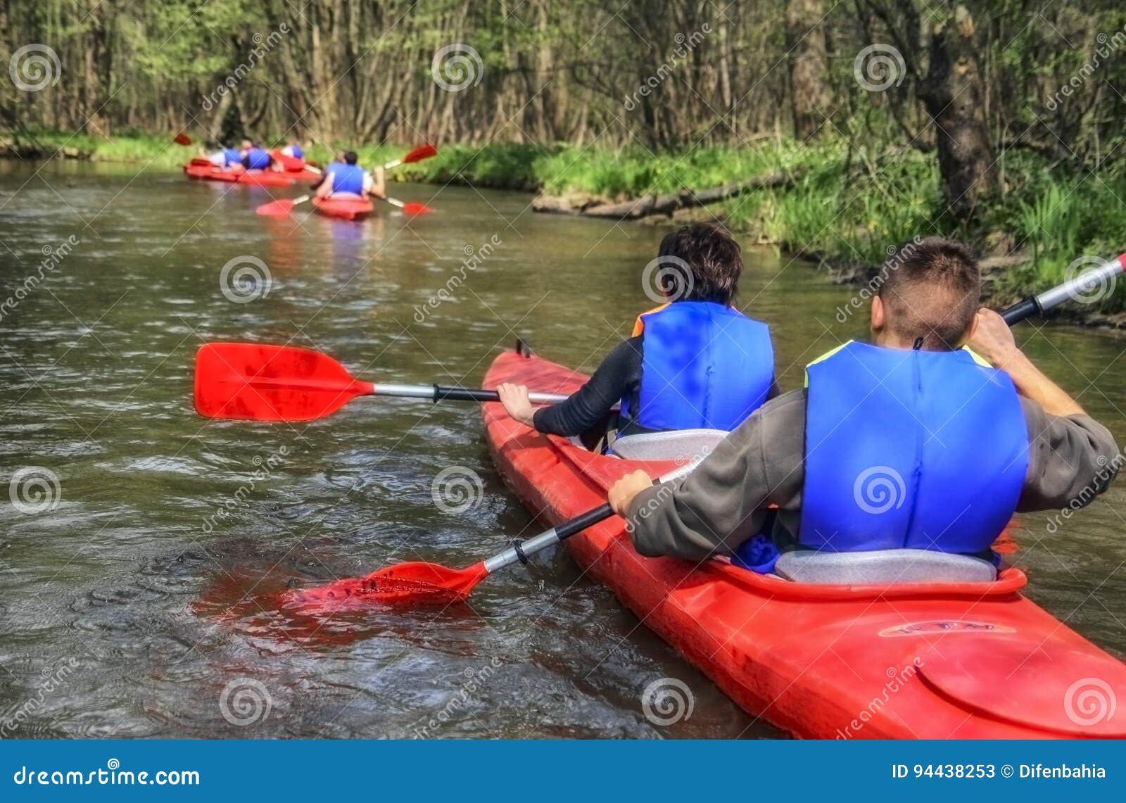 Tourists kayaking on river editorial stock photo. Image of activity ...