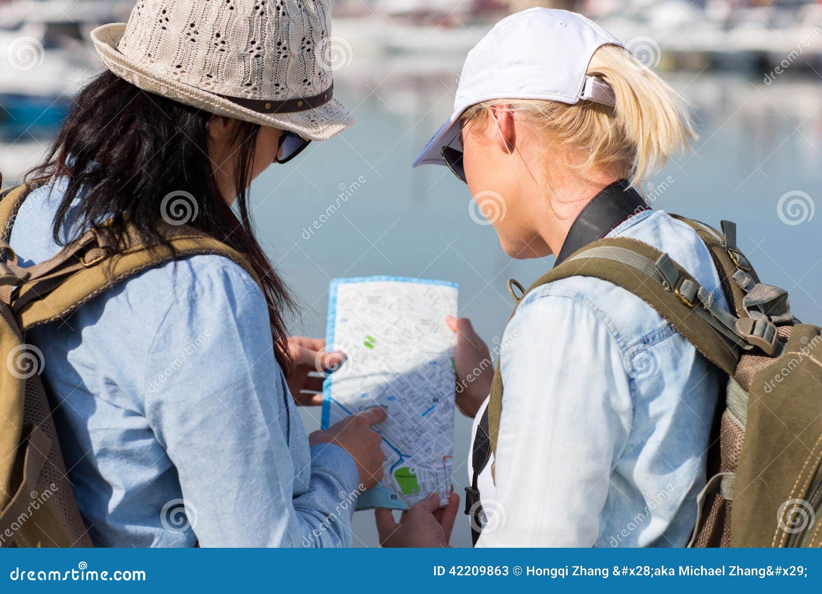 Tourists looking at map stock image. Image of boats, pretty - 42209863