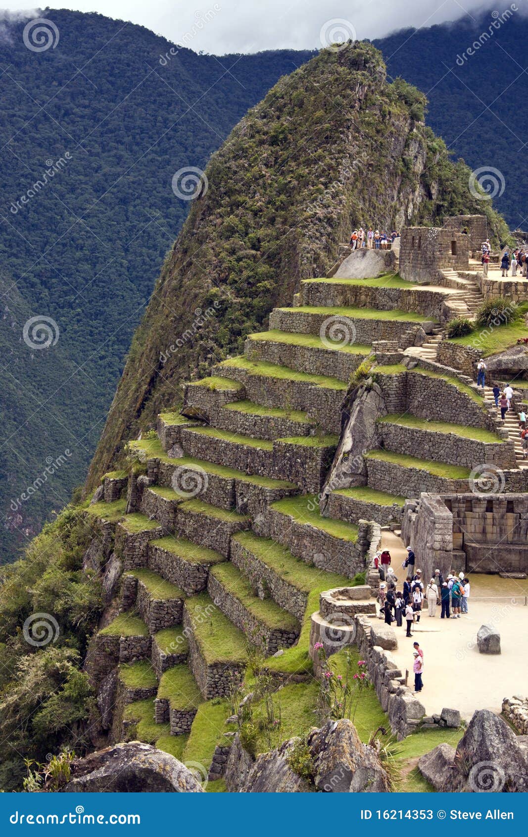 MACHU PICCHU, CUSCO, PERU- JUNE 4, 2013: Tourist Climbing Huayna Picchu ...