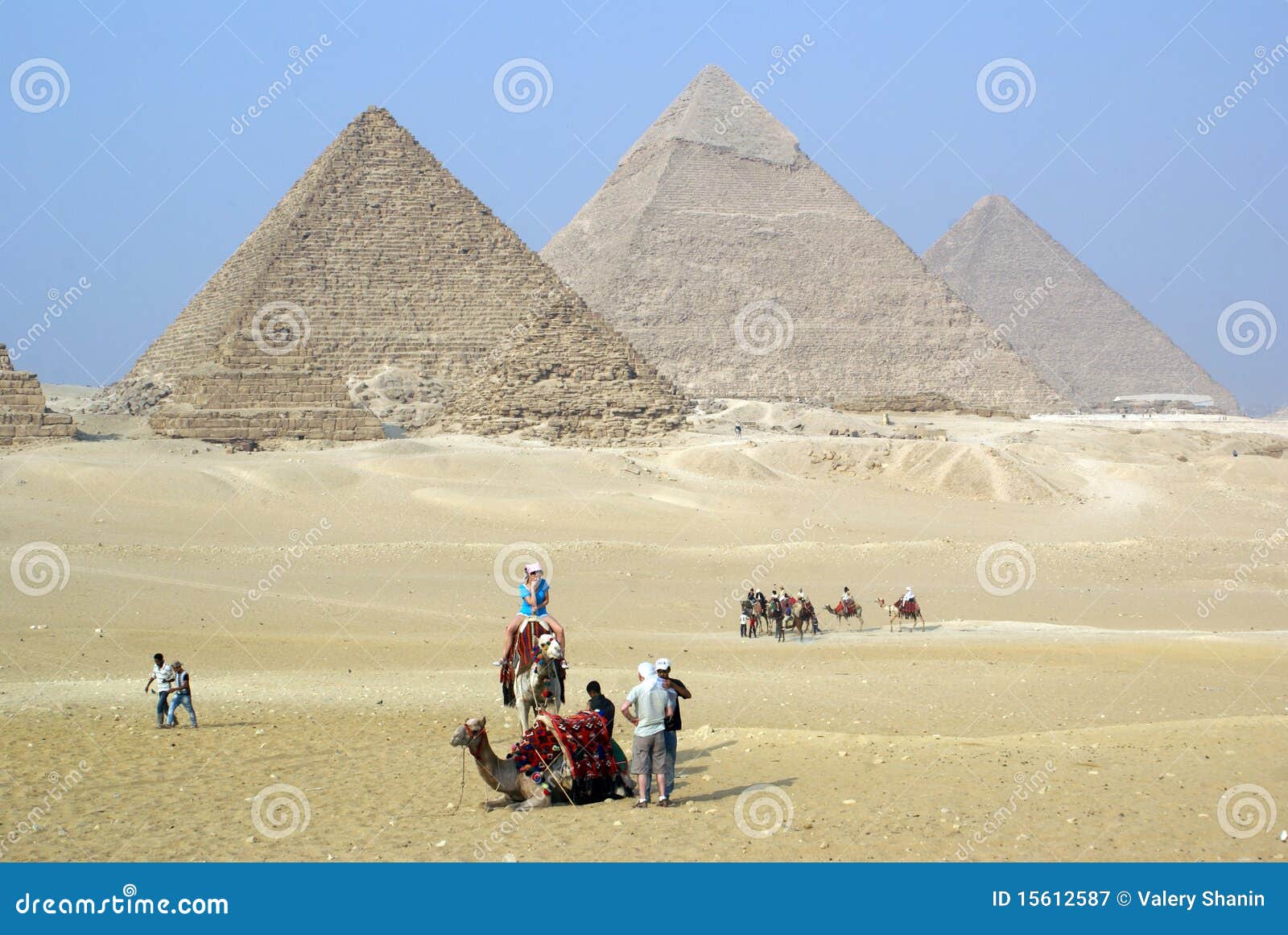 Tourists On Camels Are Seeing Khufu, Khafre, Menkaure And Pyramids Of ...