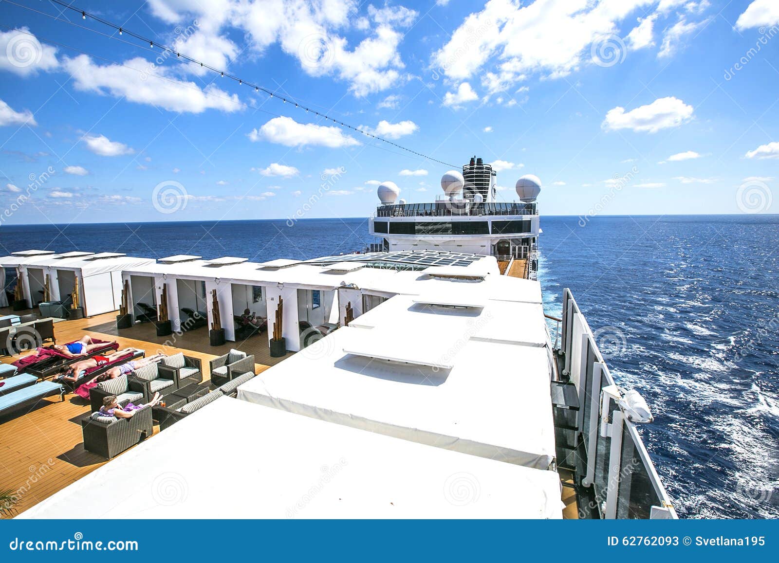 Tourists Relax and Take a Sun Bath on the Upper Deck of a Cruise Stock ...