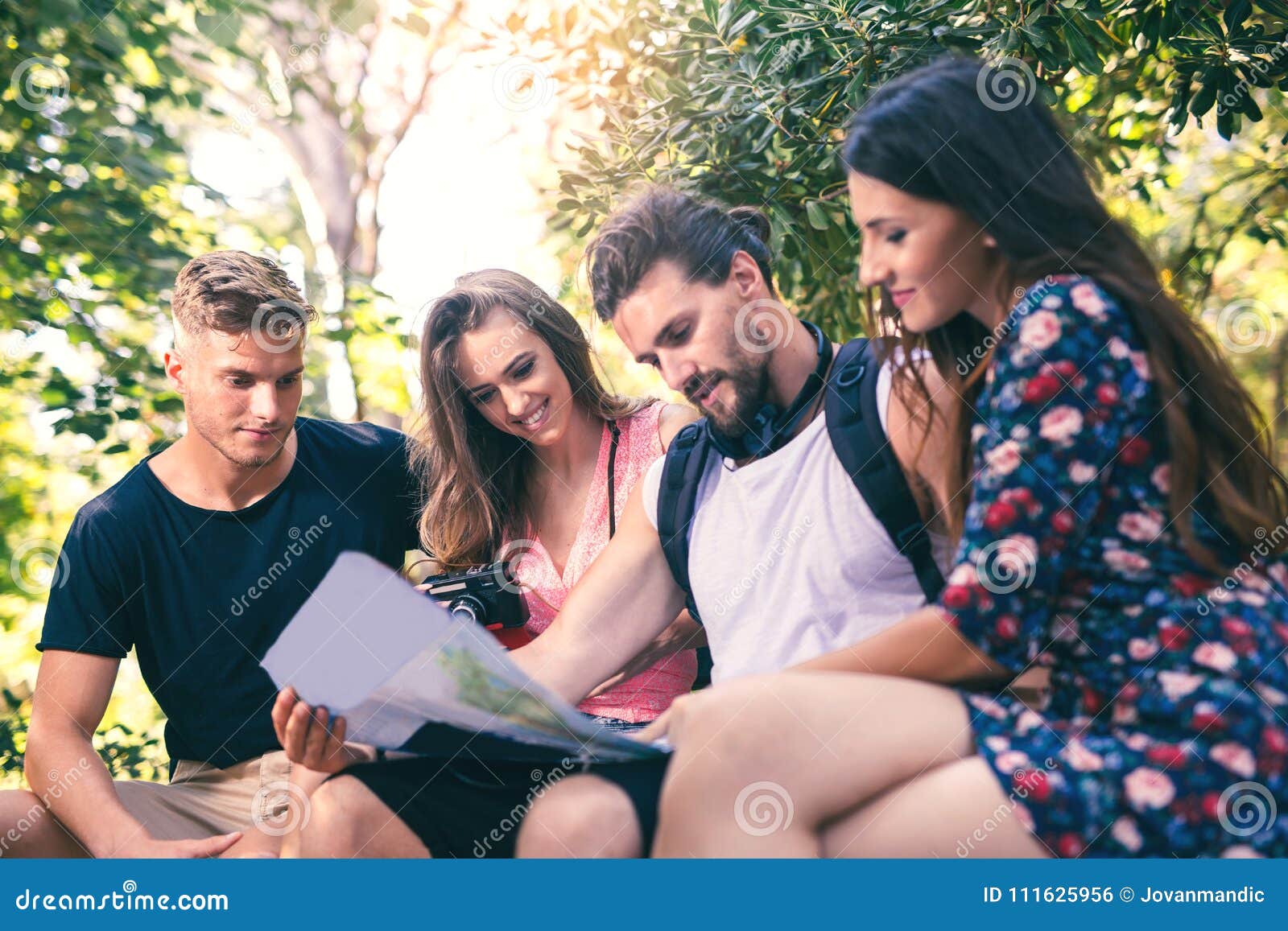 Tourists Searching for Direction Using Paper Map Stock Photo - Image of ...