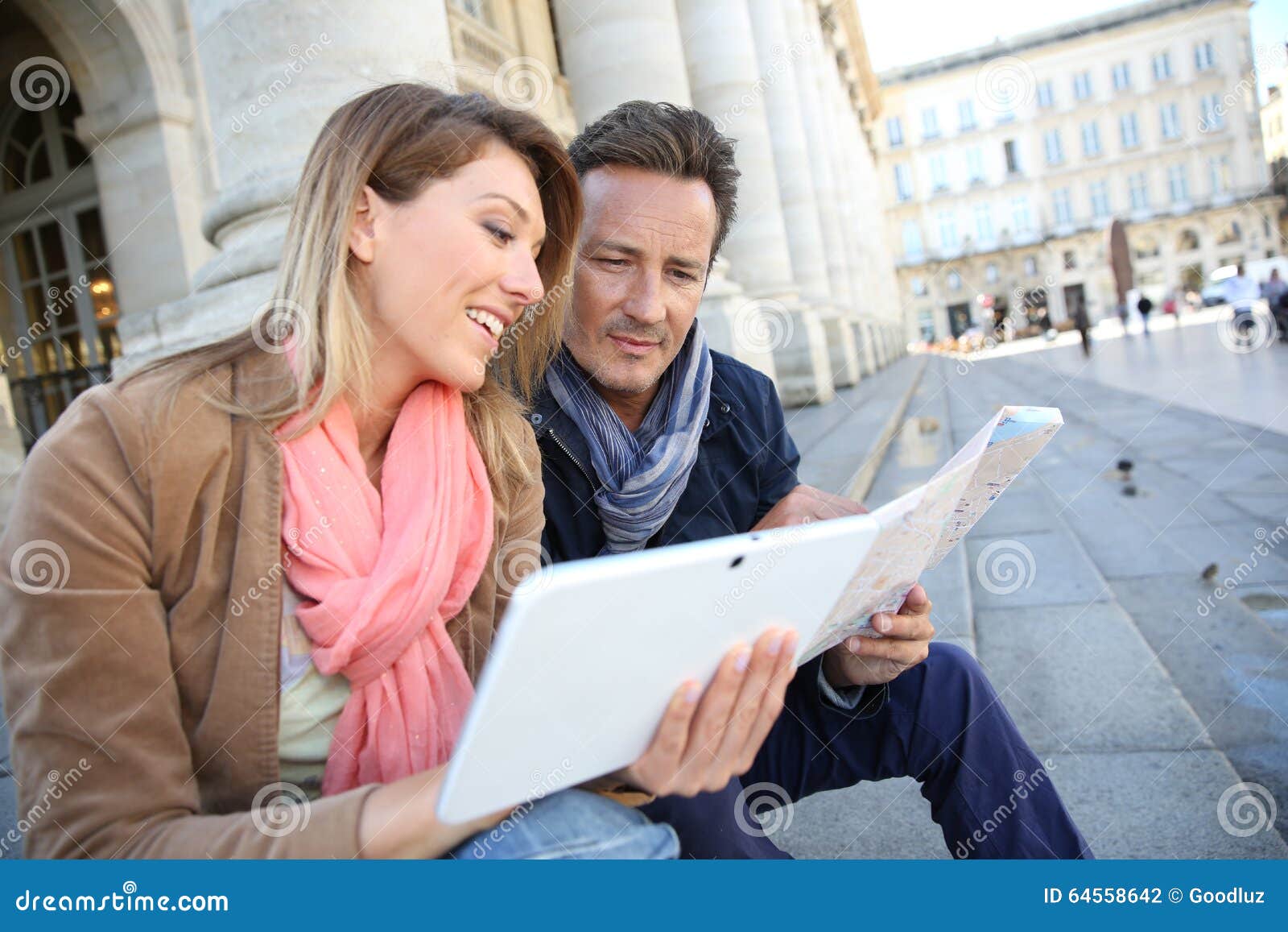 Tourists in Town with Map and Tablet Stock Photo - Image of tour, aged ...