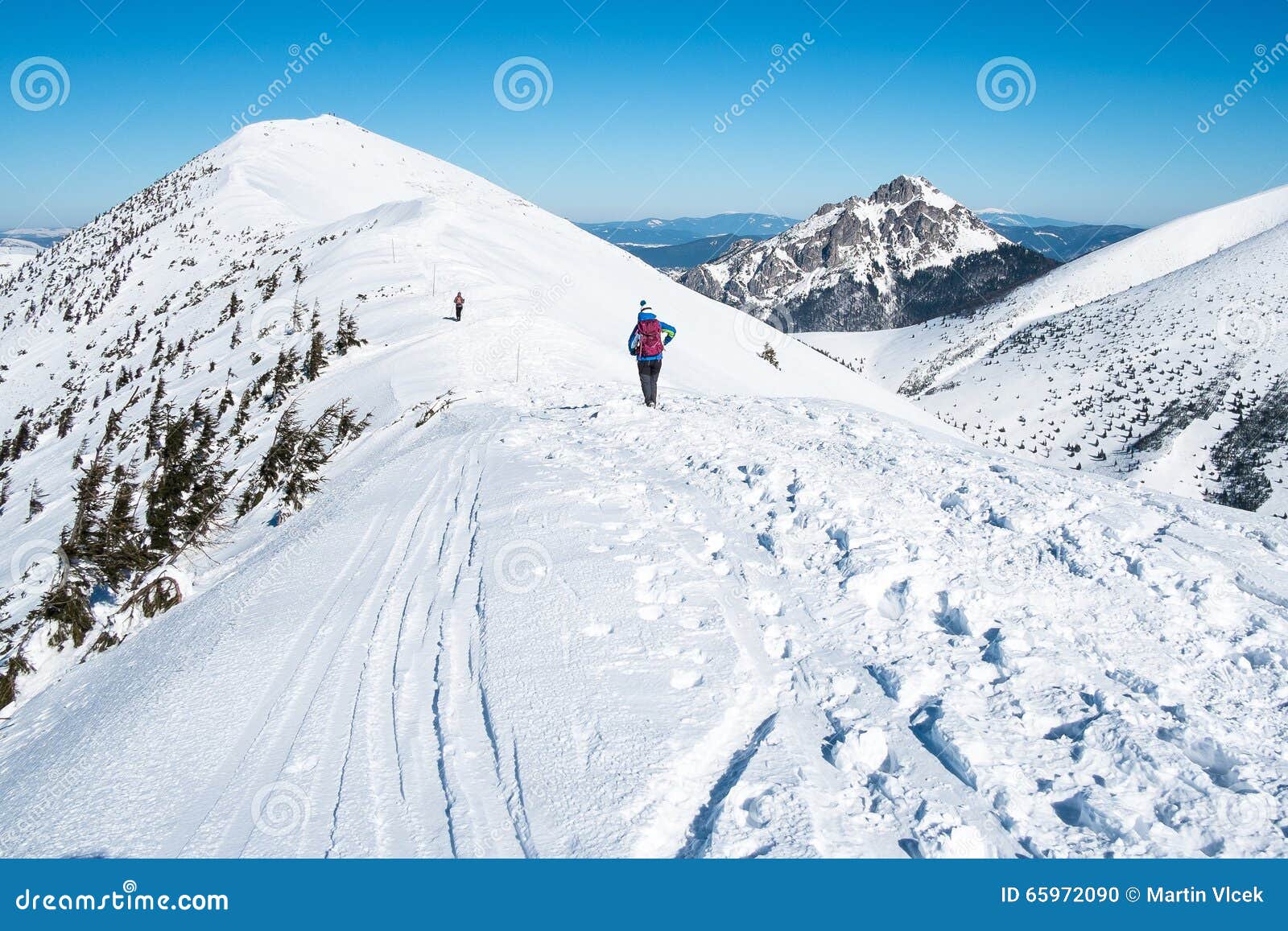 Tourists Walking Along the Ridge of Snowy Mountains Stock Photo - Image ...