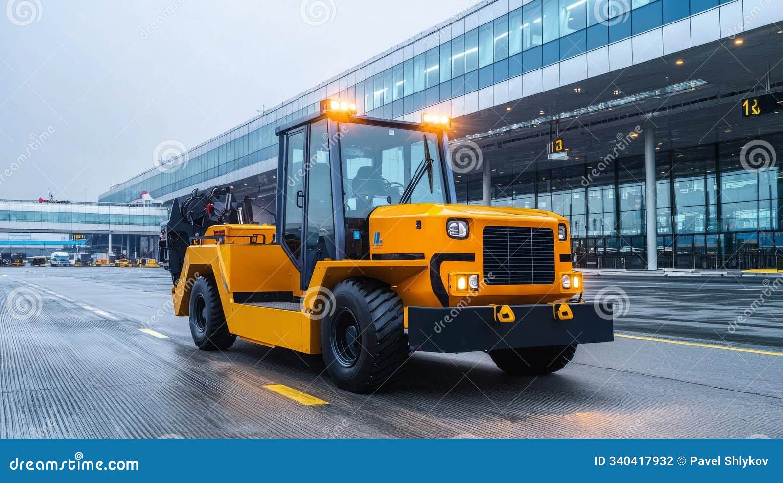 Tow Tractor Pulling Luggage Carts at Airport Apron Stock Photo - Image ...