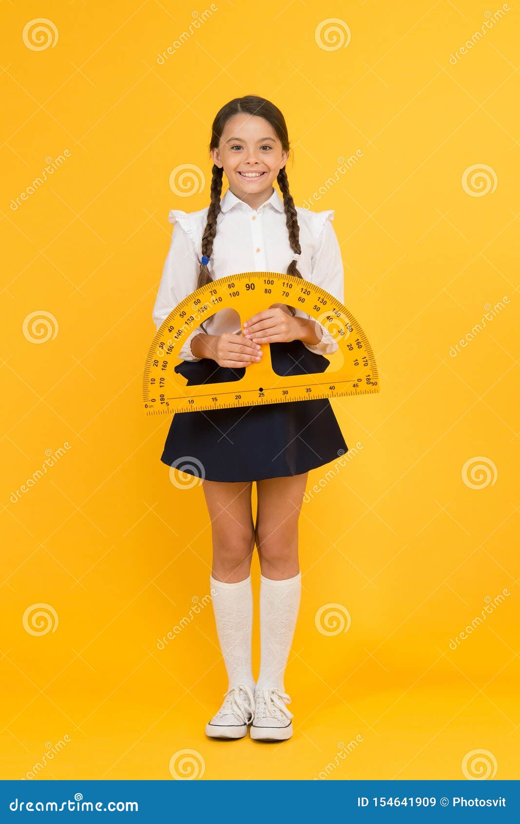 Towards Knowledge. Happy Small School Girl Study Geometry. Student Use ...