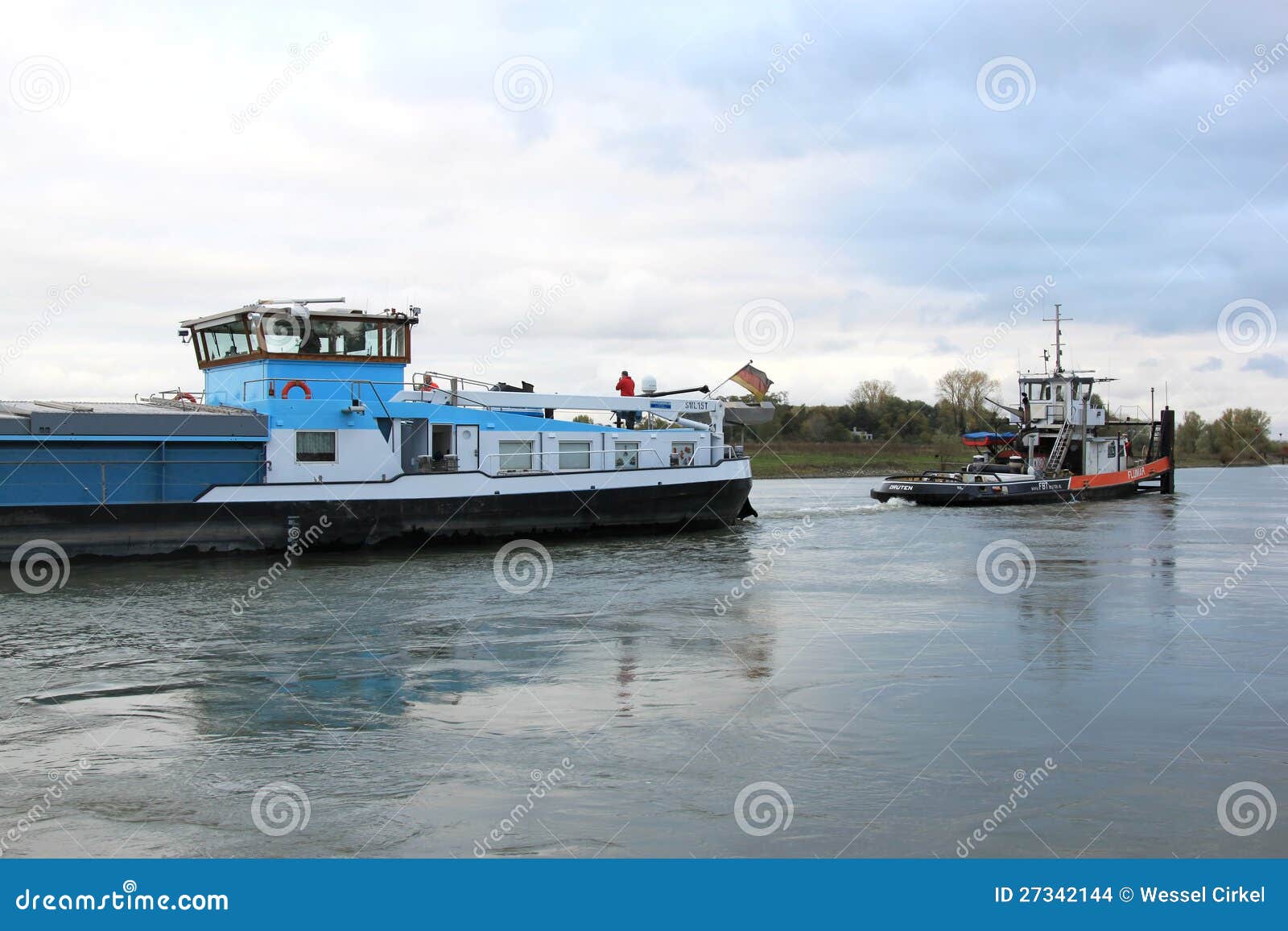 Towboat Pulls Rudderless Freighter at Dutch River Editorial Stock Image ...