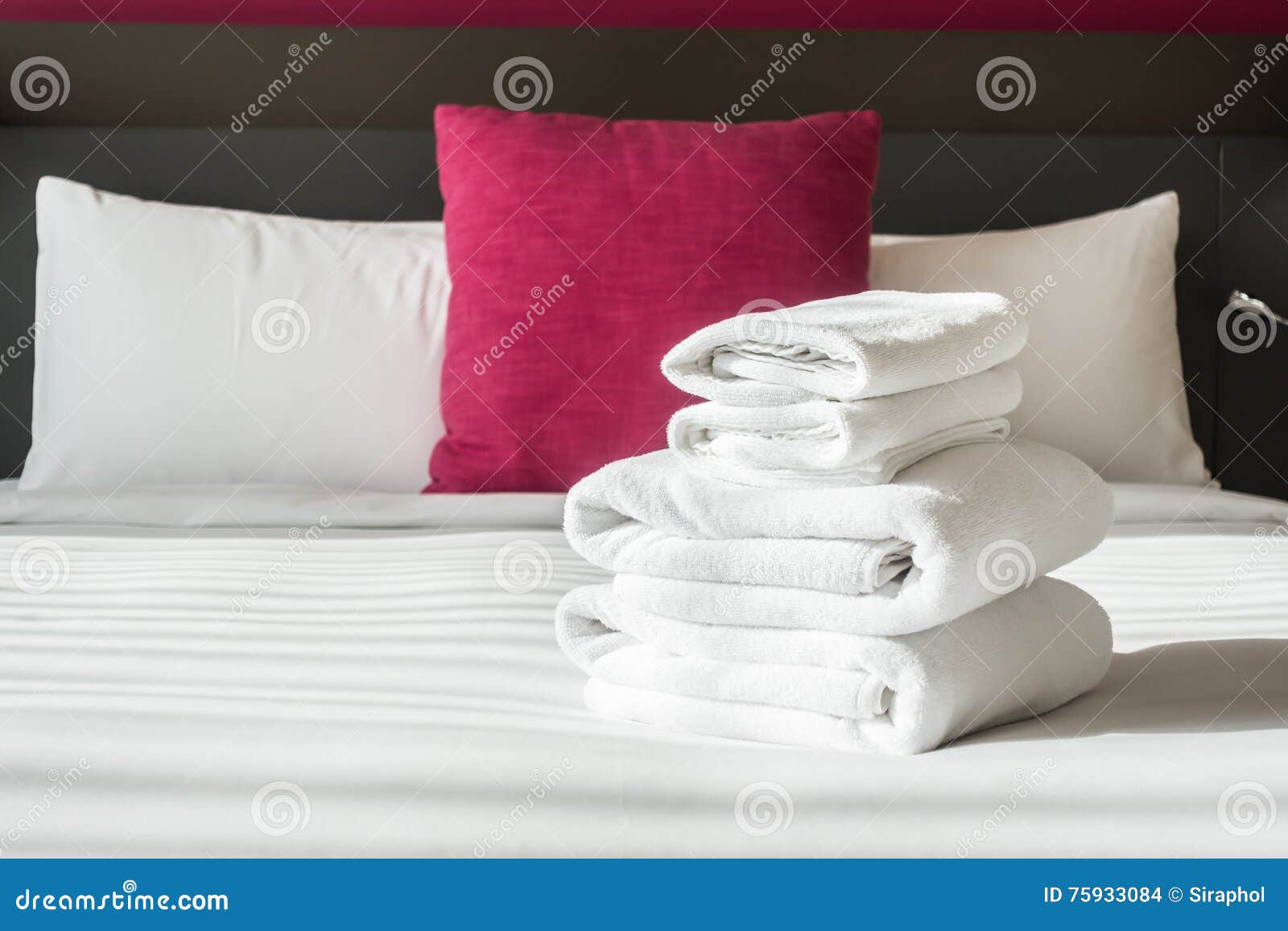 Towel on bed stock photo. Image of fluffy, hotel, freshly - 75933084