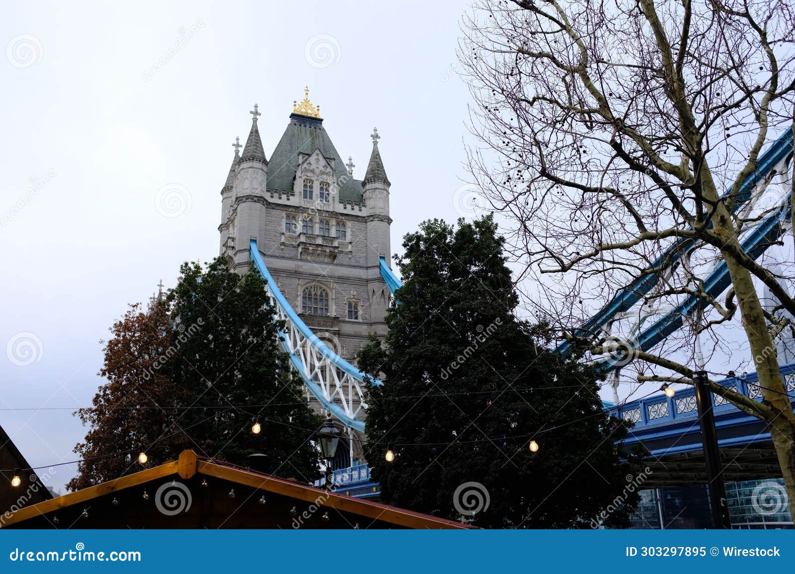 The Tower Bridge is Tall Over Trees and Trees that are in Front Stock ...