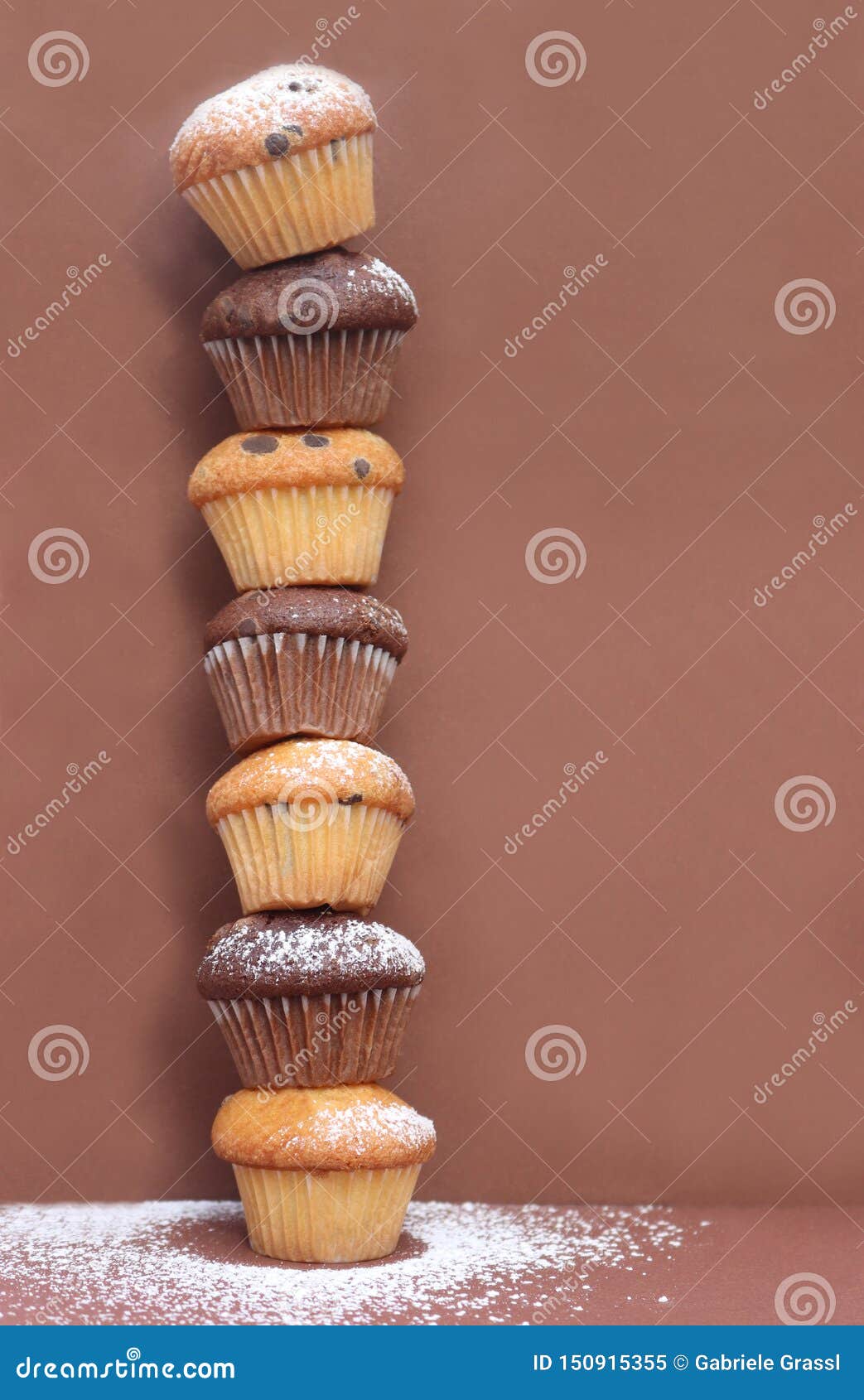 Tower Built with Muffins in Front of a Brown Background Stock Image ...