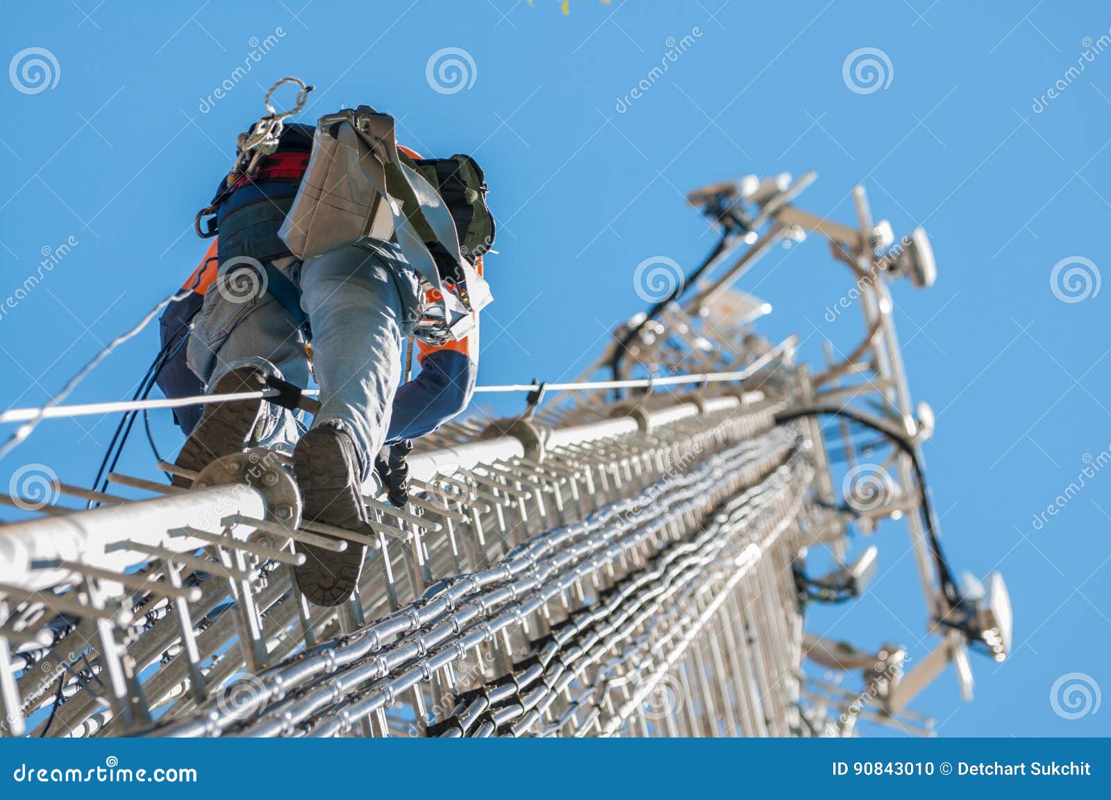 Tower Climber And Working On Cellular Tower System. Royalty-Free Stock ...