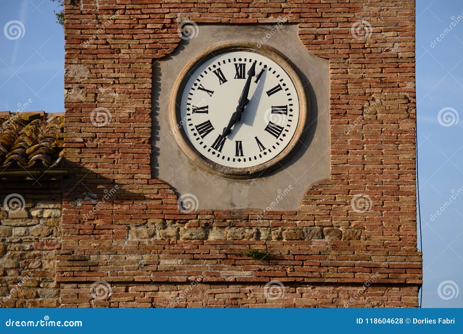 Tower Clock with Roman Numerals in Front of Brick Wall Stock Photo ...